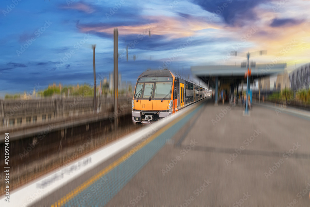 Commuter Train fast moving through a Station in Sydney NSW Australia ...