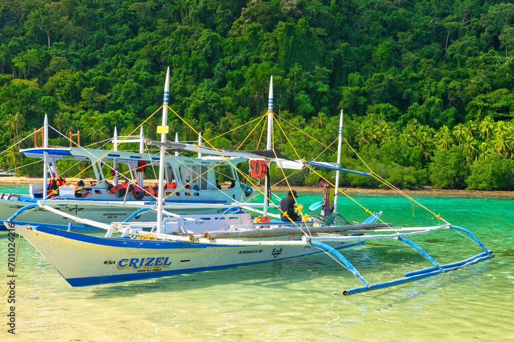 PALAWAN, PHILIPPINES - DECEMBER 21, 2023: Local traditional outrigger ...