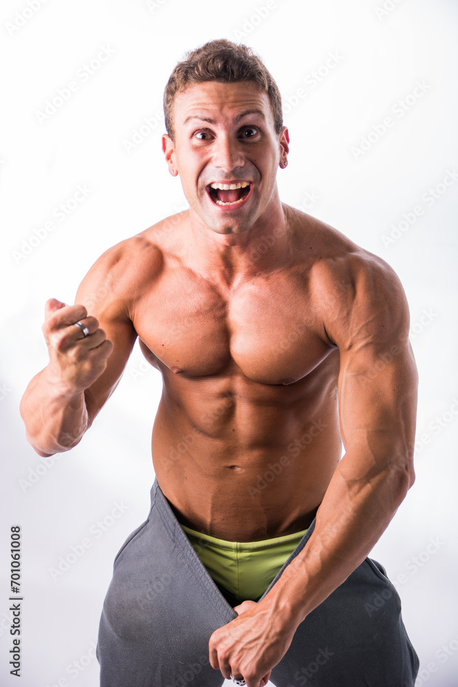 Shirtless Male Bodybuilder Has Lost Weight, Wearing Large Pants, happy ...