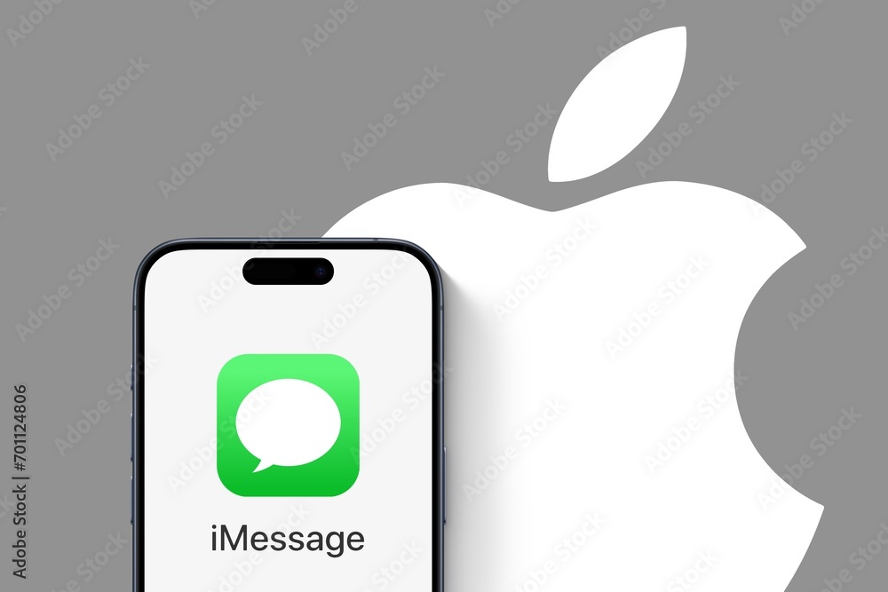 iMessage App logo shown on iPhone 15 Pro in front of Apple Logo, messenger, chat, communication ...
