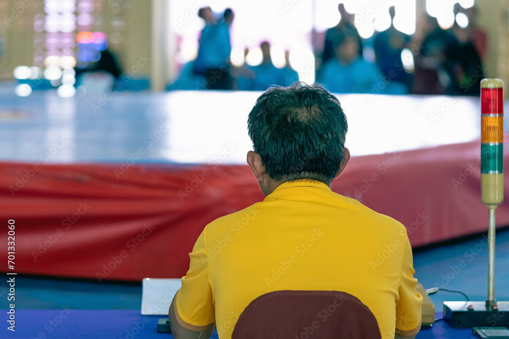 Back view of Judges work during Wushu Boxing Cup among young women ...