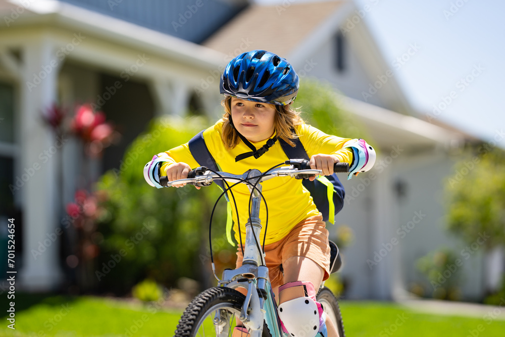 Boy in a helmet riding bike. Boy in safety helmet riding bike in city ...