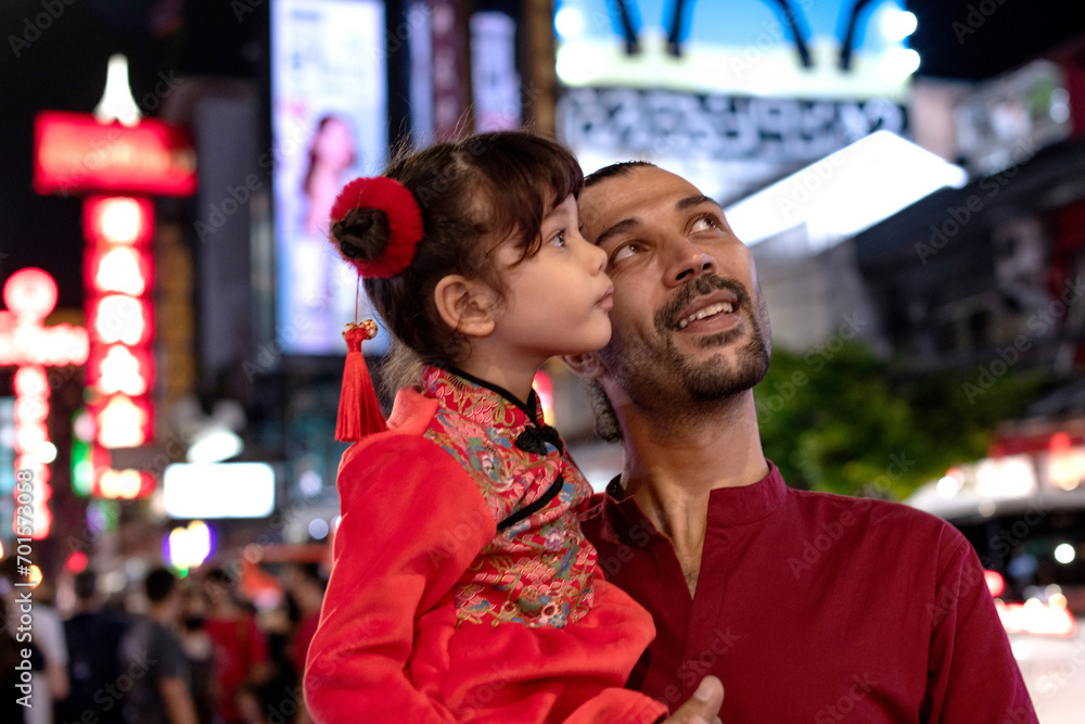 Happy father and daughter in traditional Chinese costumes enjoying ...