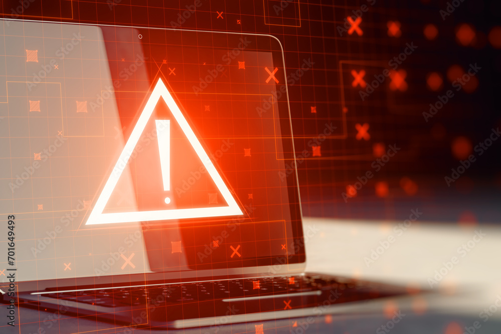 Laptop with creative red security alert on blurry background. Fraud and ...
