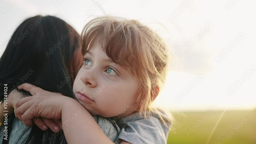 daughter hugging mom. happy family a kid dream concept. mother carries ...