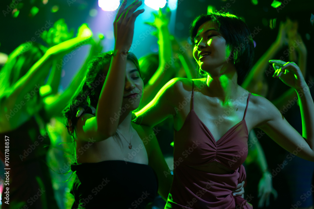 Sexy young woman people dancing and holding champagne glass in night ...