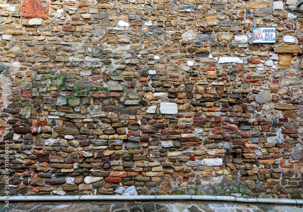 Grado, Italy - January 01th, 2024: Wall of a house in the historic part ...