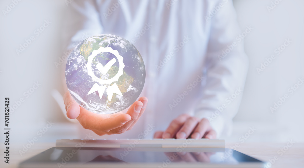 Sustain earth concept hands holding global with sign of the top Quality ...