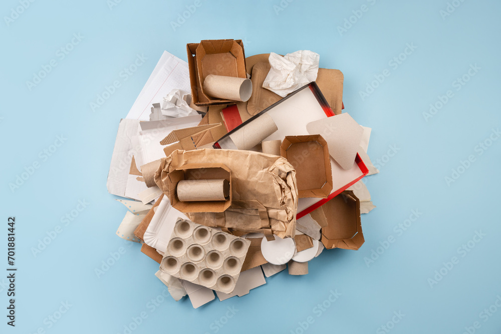 Separate collection of paper garbage. Paper stuff for recycle on blue ...