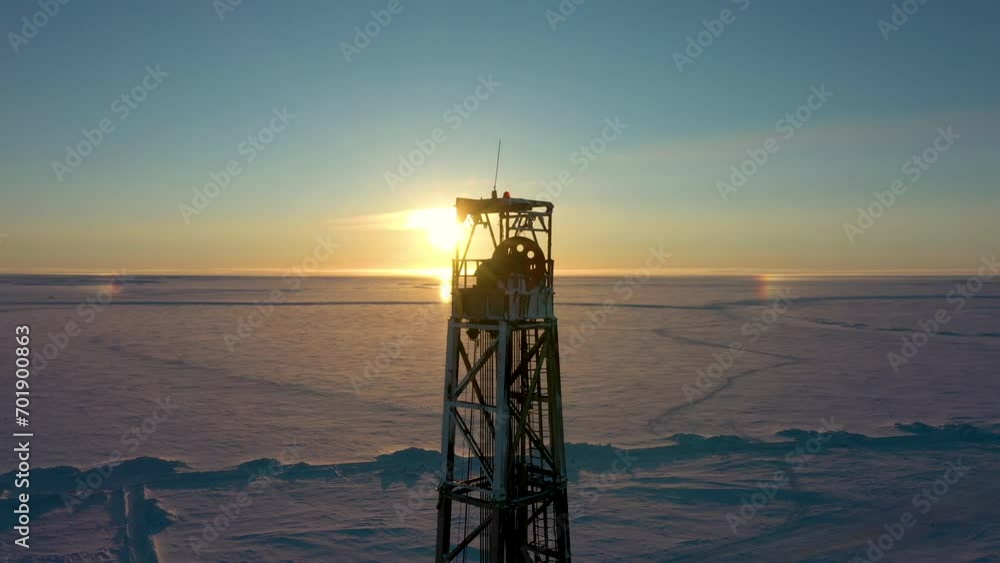 Upper part of drilling rig in rays of sun. Wheel of derrick crown block ...