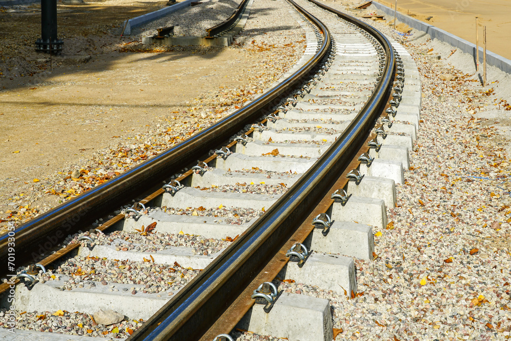 New streetcar rail track laying in city street on new concrete sleepers ...