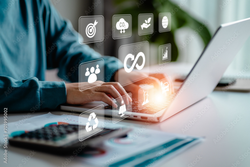 Businesswomen using laptop computers with ESG icon concepts for ...