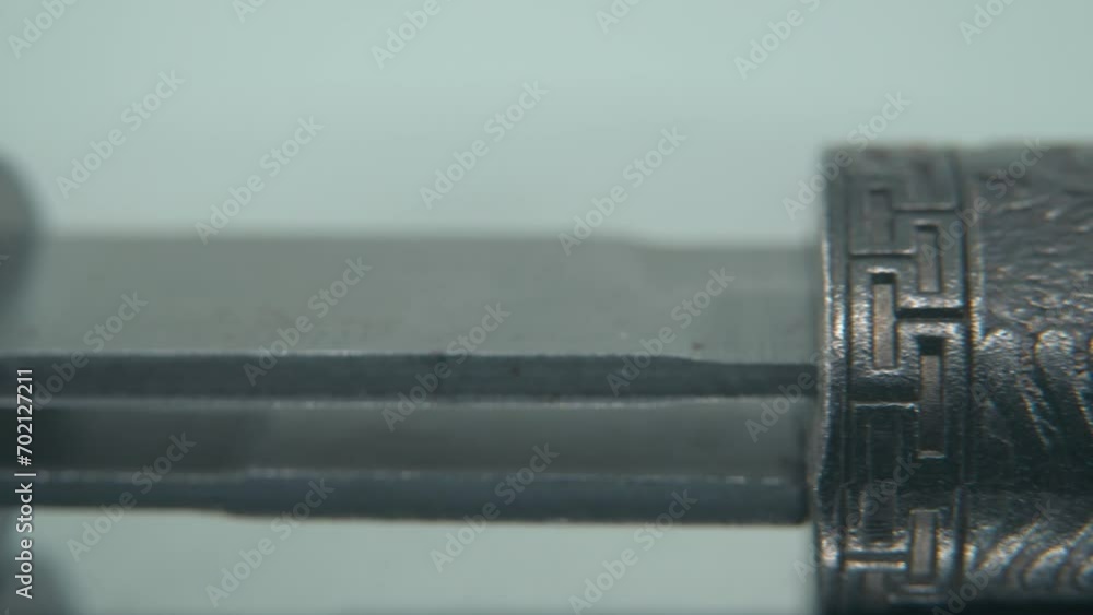 A macro close-up shot of an ancient silver knife, Chinese antique ...