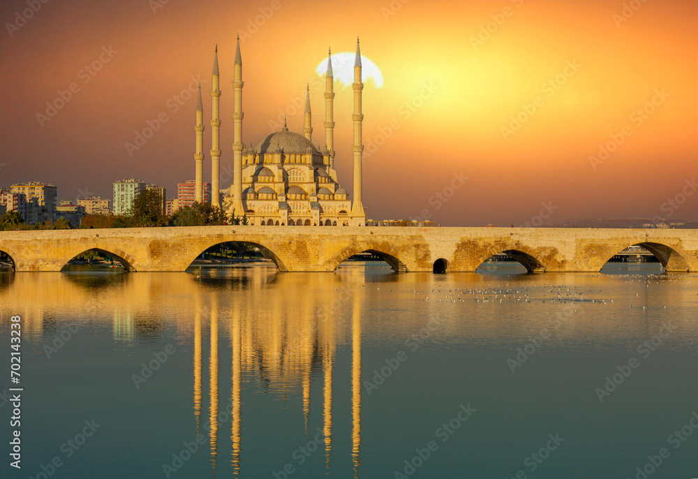 Stone bridge (Taşköprü in Turkish) and the main mosque in Adana, Turkey ...