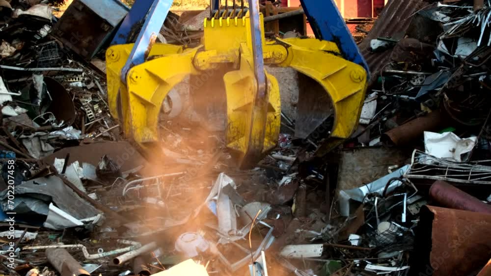 Metal scrap being loaded into a ship for recycling. Recycling metal ...