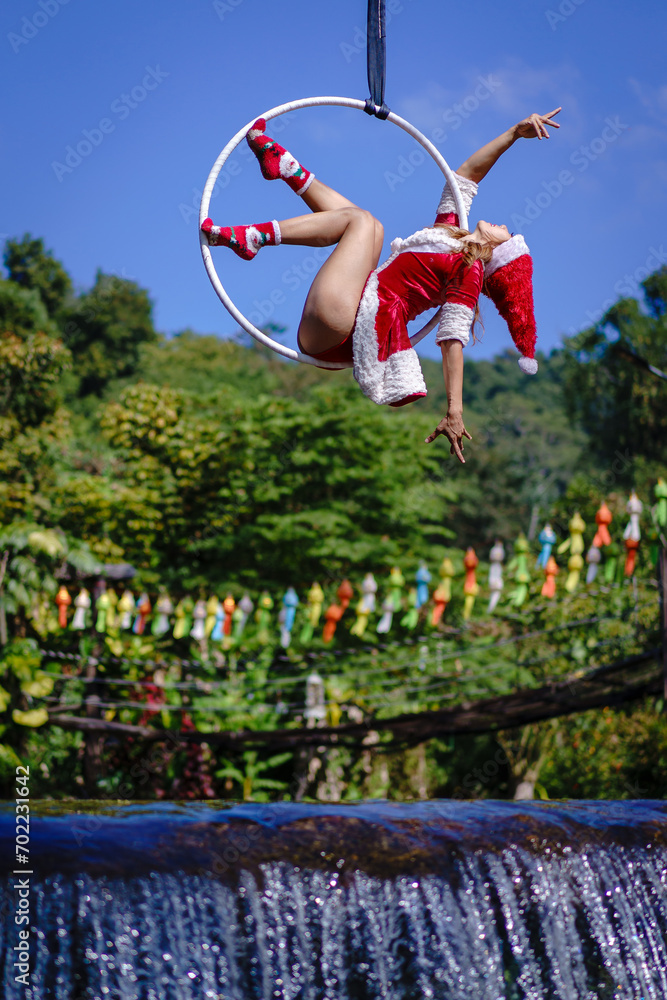 Beautiful Asian girl performing show aerial hoop or aerial ring in ...