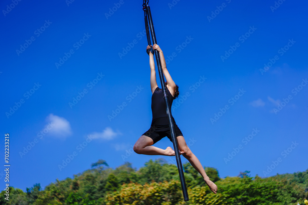 Beautiful Asian girl shows extreme advances by performing pole dance ...