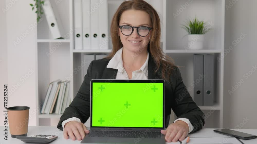 Chroma key green screen layout. Confident woman in office with ...