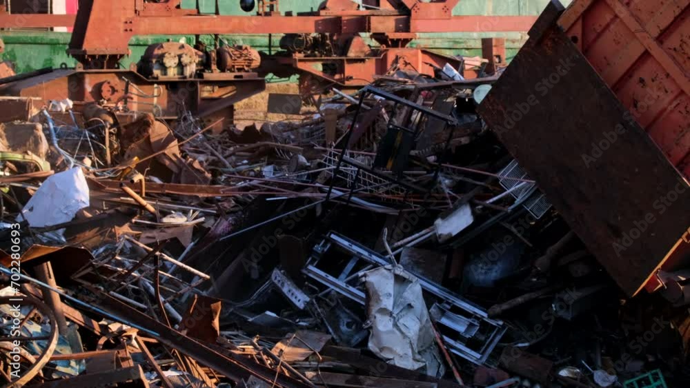 Metal scrap being loaded into a ship for recycling. Recycling metal ...