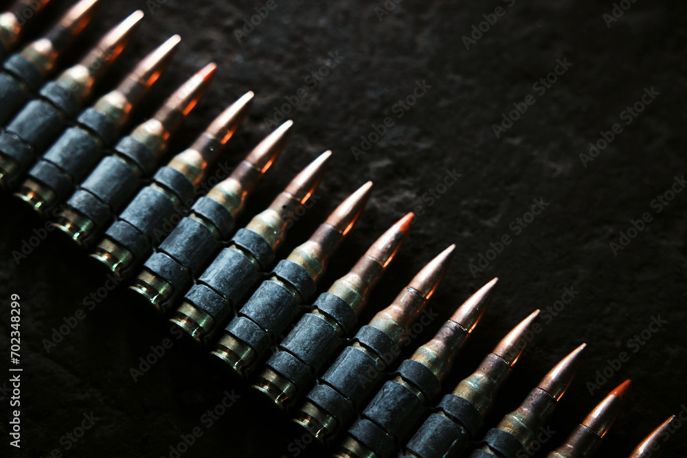 Machine gun bullet belt on the floor. Background on the military theme ...