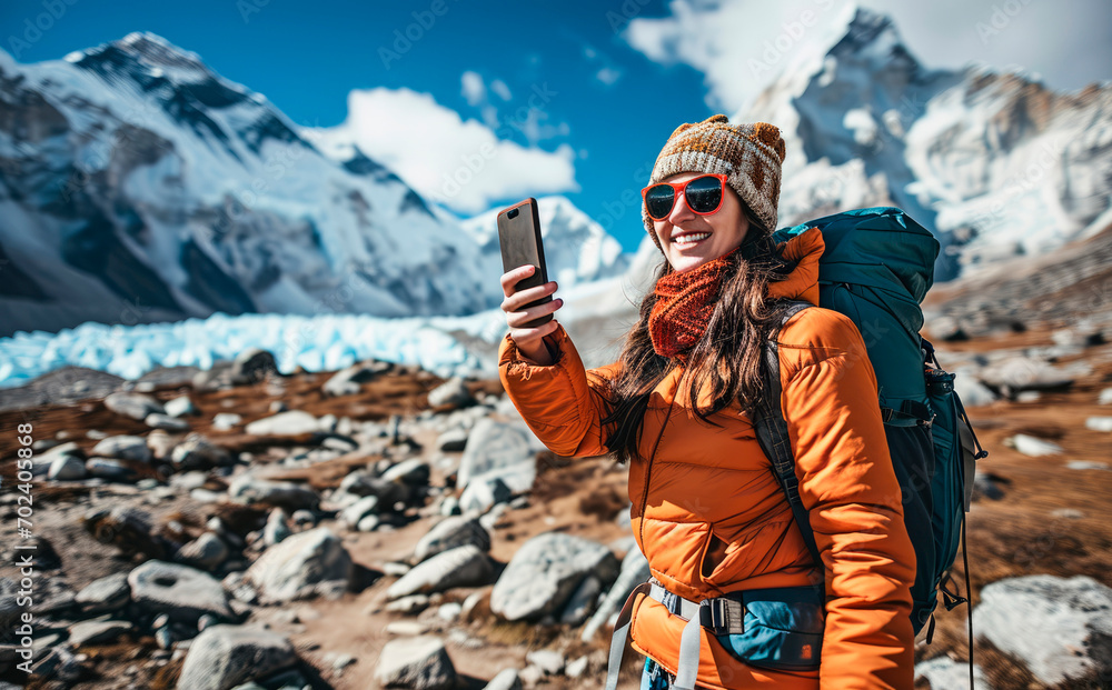 Everest Triumph: A smiling native woman with a backpack takes a selfie ...