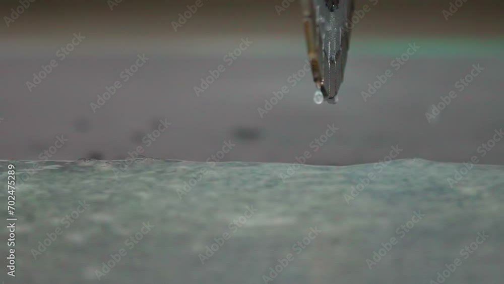 Video „Fluid Water Drops Falling From Sharp Saw On Mineral Stone ...