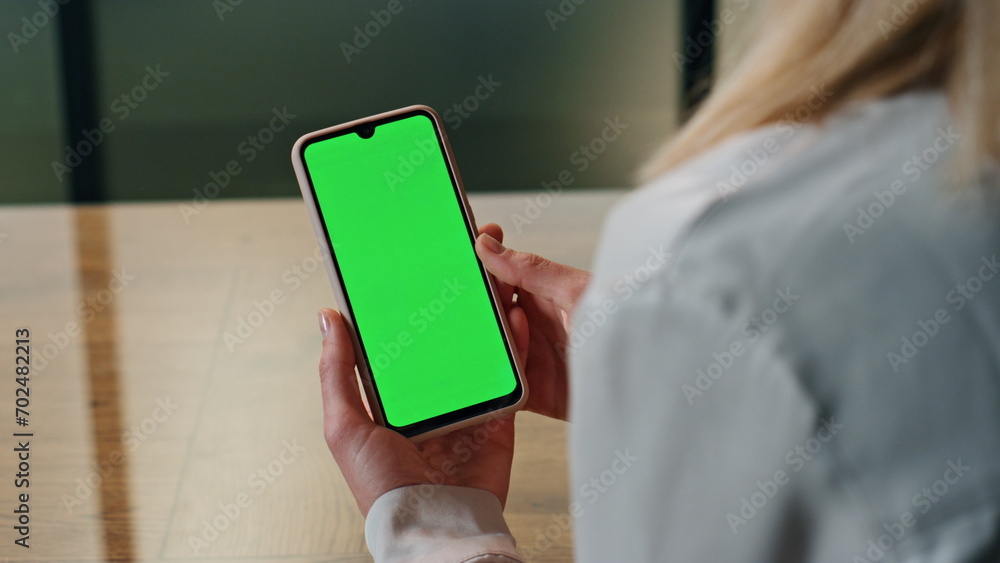 User scrolling chromakey smartphone closeup. Woman hand holding ...
