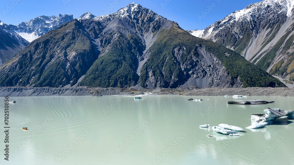 Ice and icebergs floating in the alpine lake in the Tasman valley in Mt ...