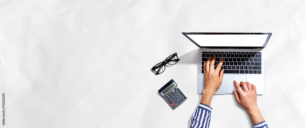 Person using a laptop computer from above Stock Photo | Adobe Stock