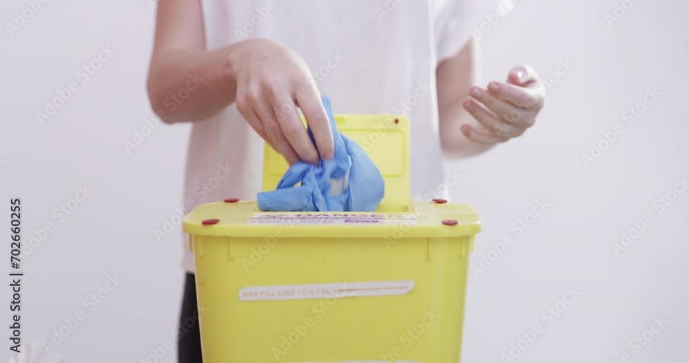 Hands, person and medical waste bin with gloves, healthcare for safety ...