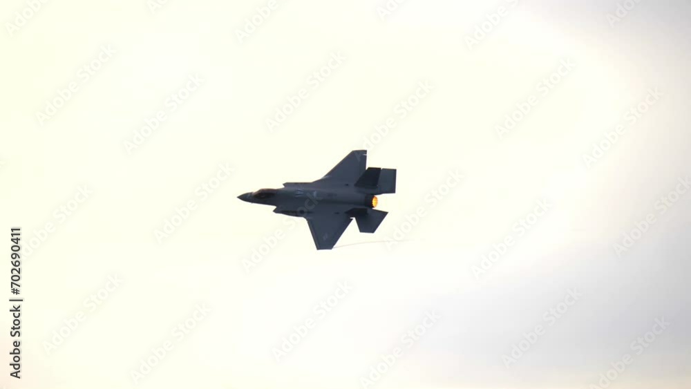 F-35 Fifth-Generation Fighter Jet Igniting Afterburner, Tracking Shot ...