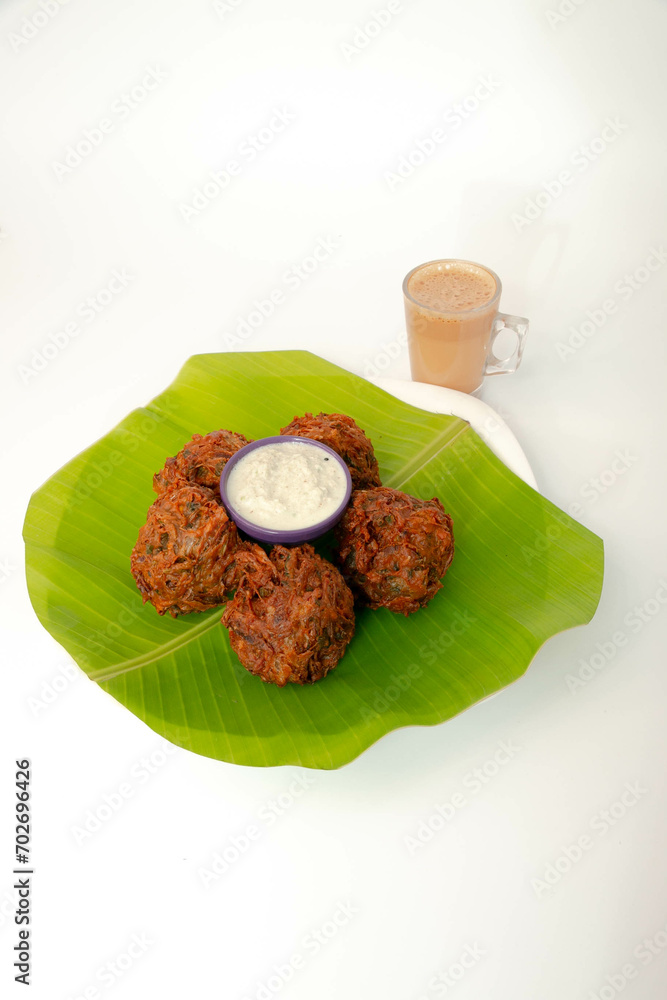 Ulli Vadai with Chaay, It's a beloved snack, often enjoyed with a side ...