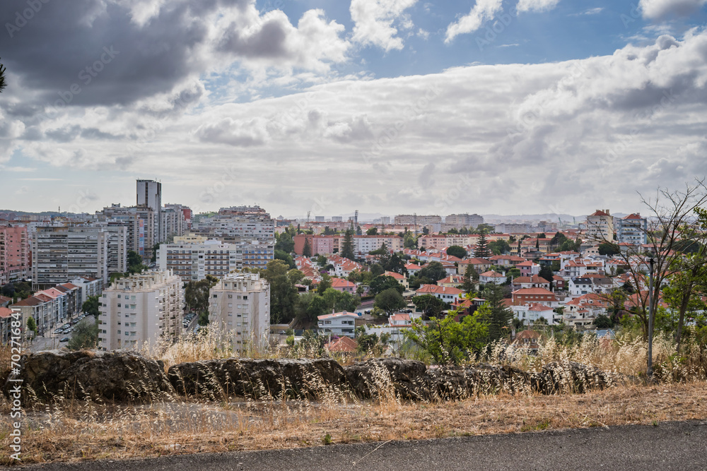 Wall and dried herbs overlooking the architecture of the Alvalade ...