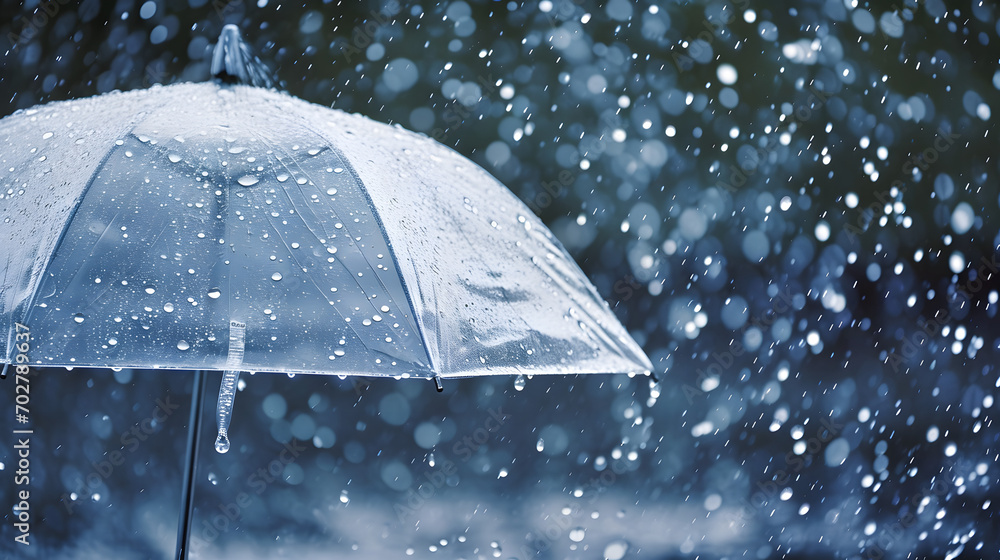 Transparent umbrella under heavy rain against water drops splash ...