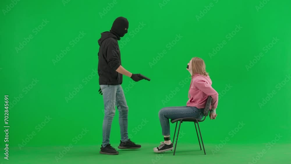 Portrait of thief and victim on chroma key green screen background ...