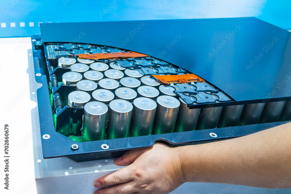 hand with Lithium ion industrial high current batteries and connector ...