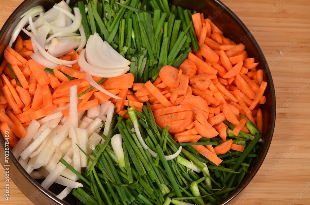 vegetables, fruits, and various cooking ingredients are lined up ...