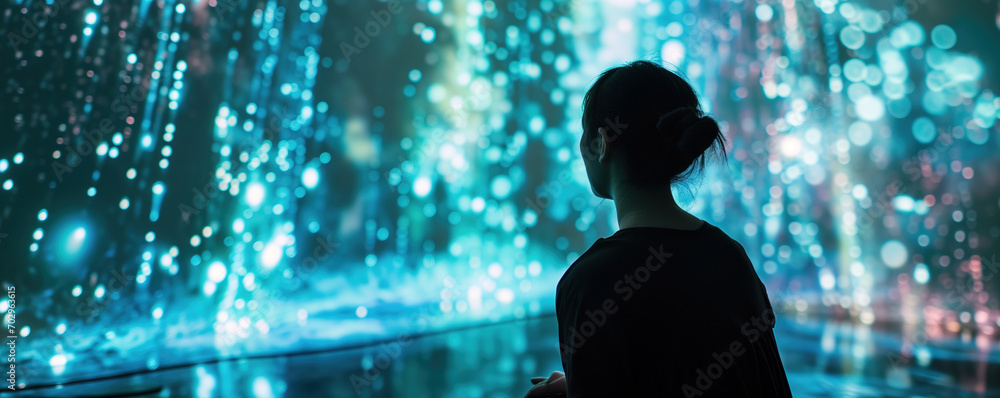 An awe-inspiring image of a person watching a 3D projection mapping ...