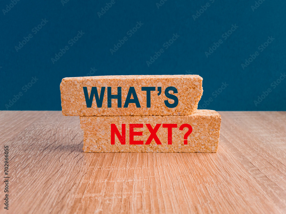 What is next symbol. Concept blue word What's next on brick blocks ...