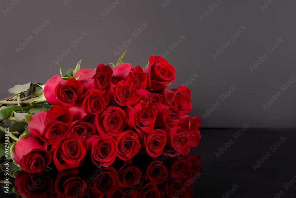 An elegant gift bouquet of long red roses of the Freedom variety with ...