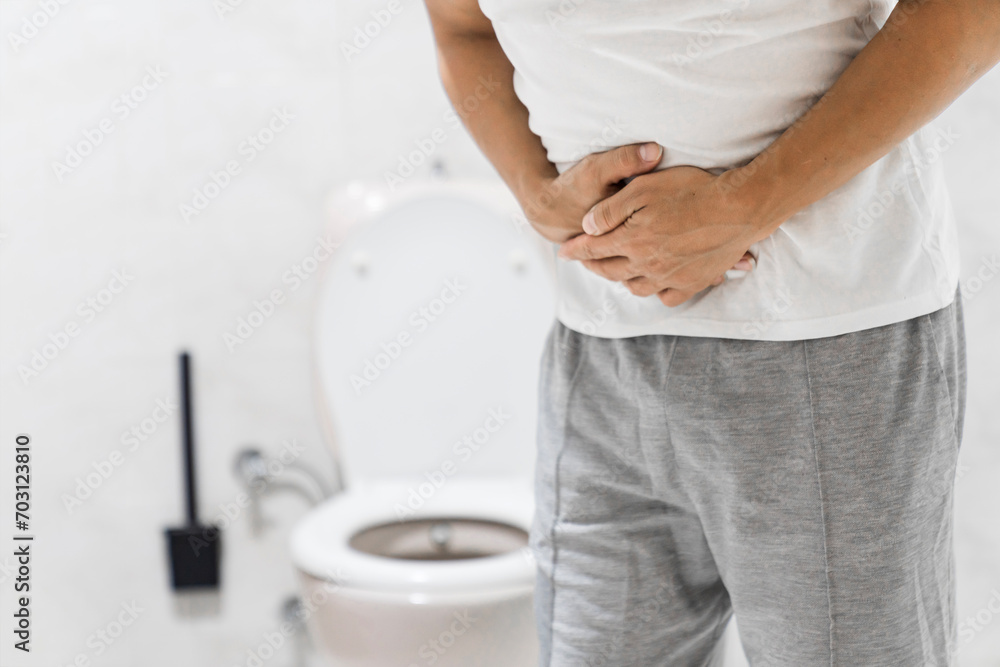 Men have stomachache and use their hands to hold their stomach In the ...