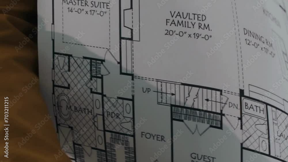 Architect checking layouts of buildings, working on design of new ...