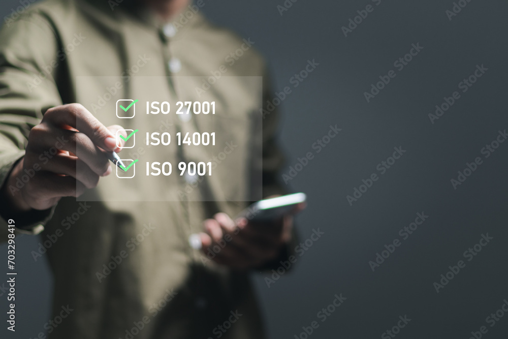 ISO concept. Businessman makes a checklist for standards iso 27001 ...
