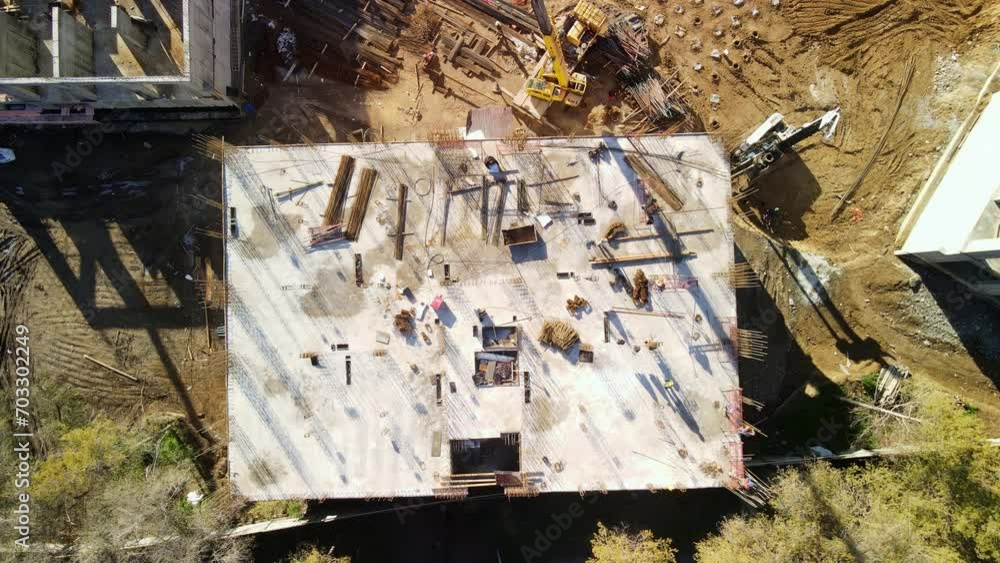 An aerial view of the construction of a residential building. The ...