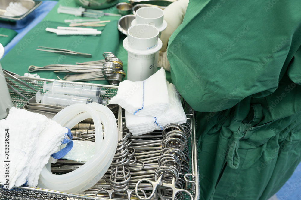 Surgeon in sterile gloves getting ready medical instruments.Surgical ...