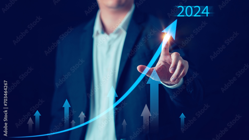 2024 Business goal, Business man pointing chart graph with 2024, future ...