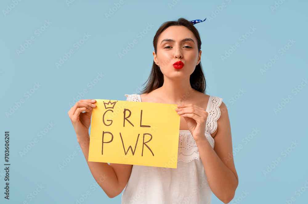 Beautiful Young Pin Up Woman Holding Paper With Text Grl Pwr On Light