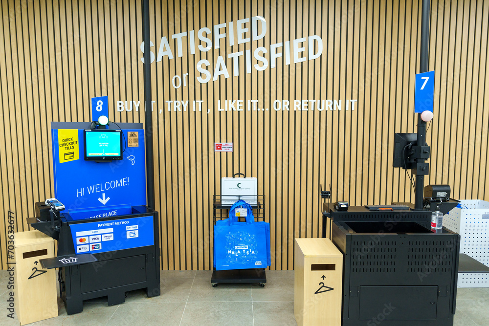 PENANG, MALAYSIA - 24 NOV 2023: Interior view of Decathlon quick checkout counter in Penang ...