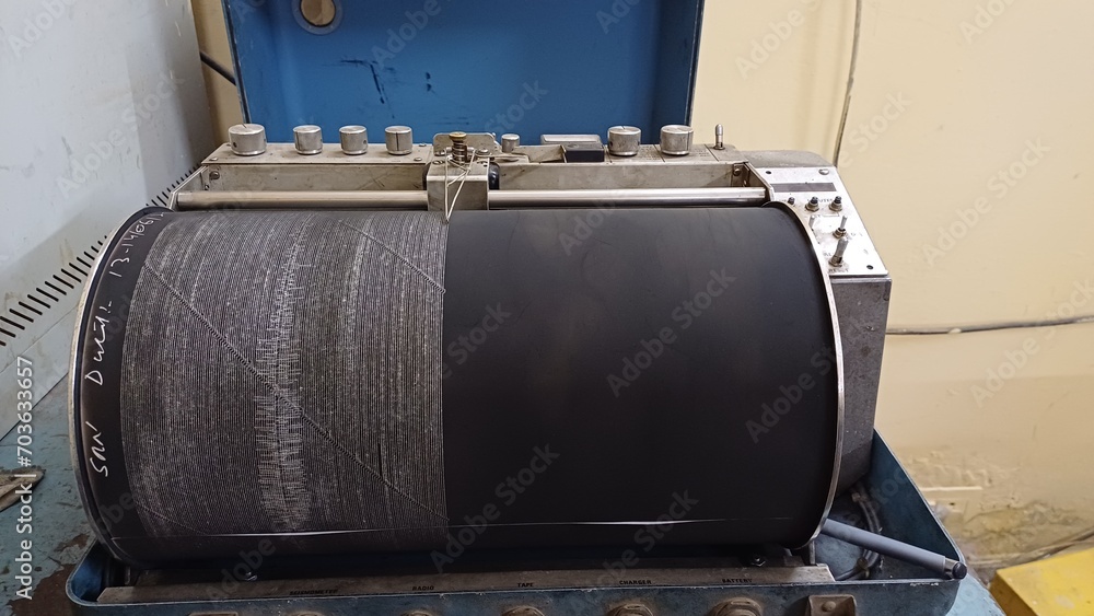 Seismograph records an earthquake on the sheet of measuring paper ...