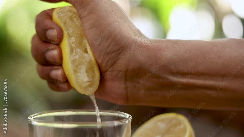 Delicious hand squeezed lemon juice The lemon juice flows from the pulp ...